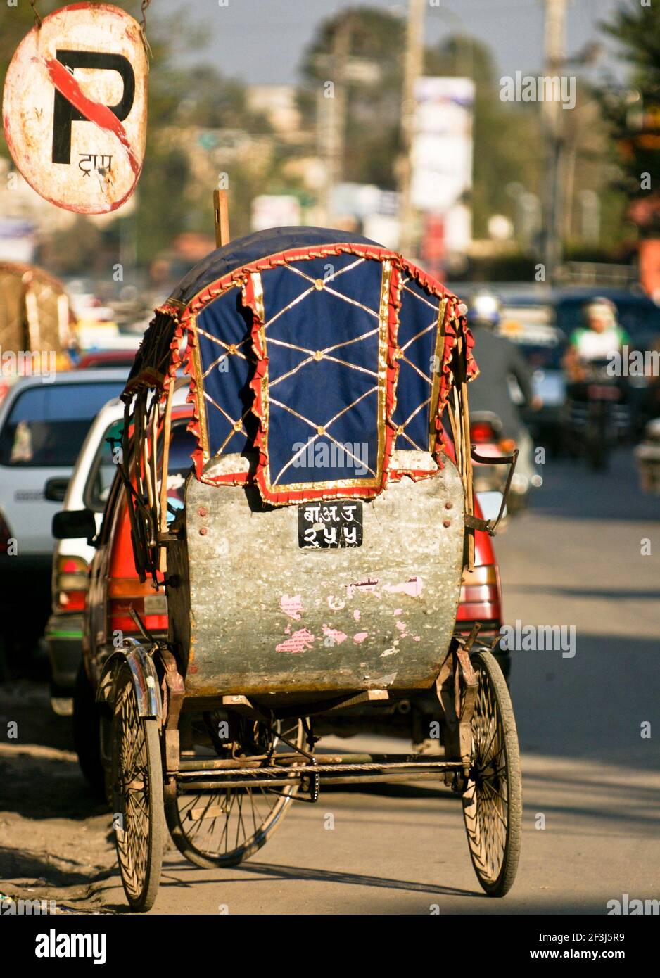 Detail view of a rickshaw with colorful canopy on a street in Khatmandu ...