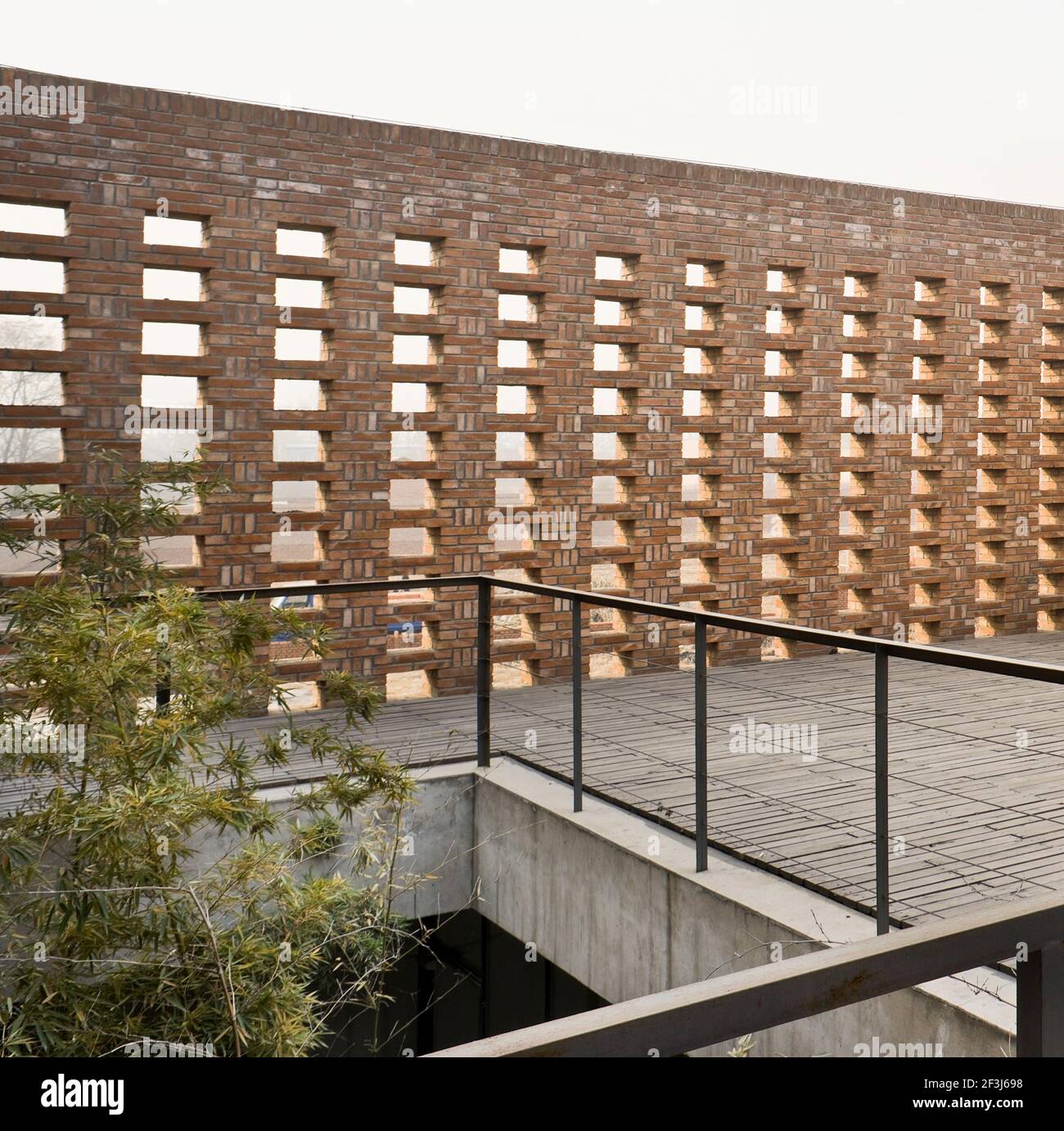A simple surround of brick wall for this roof terrace is animated by ...