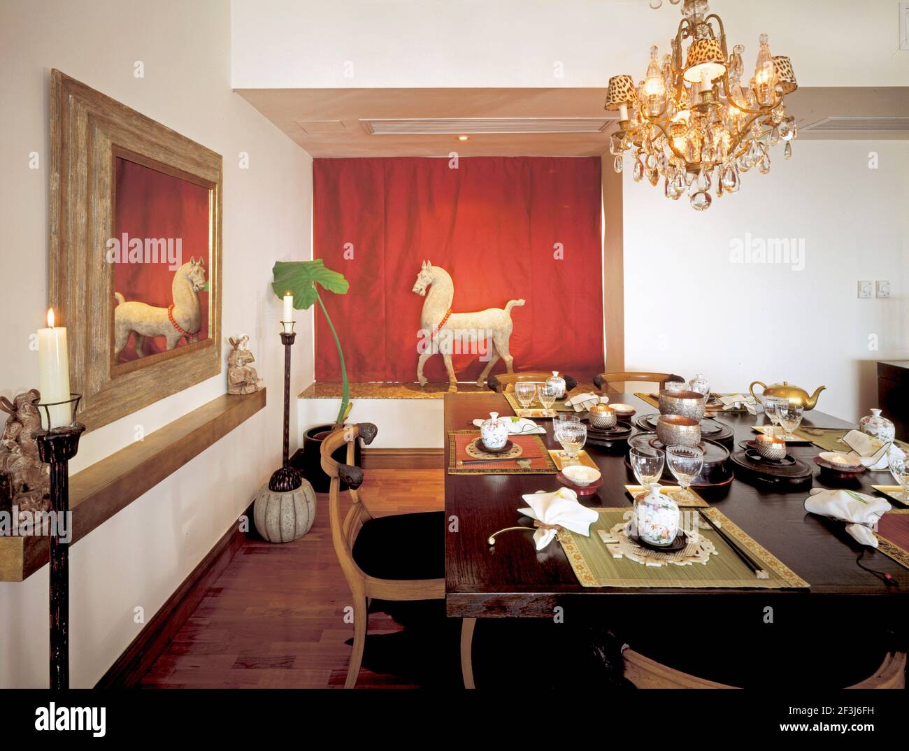 Dining area with an elegant table setting of a modern Chinese apartment ...