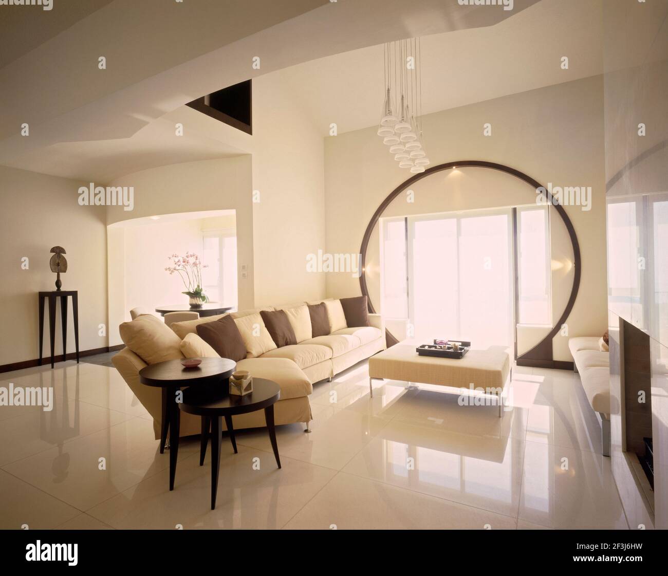 Living area of a modern Chinese house featuring a moongate window, The ...