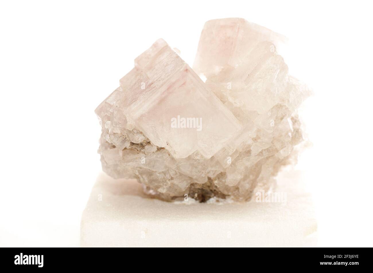 pinkish white halite crystal mineral sample, rock salt Stock Photo - Alamy