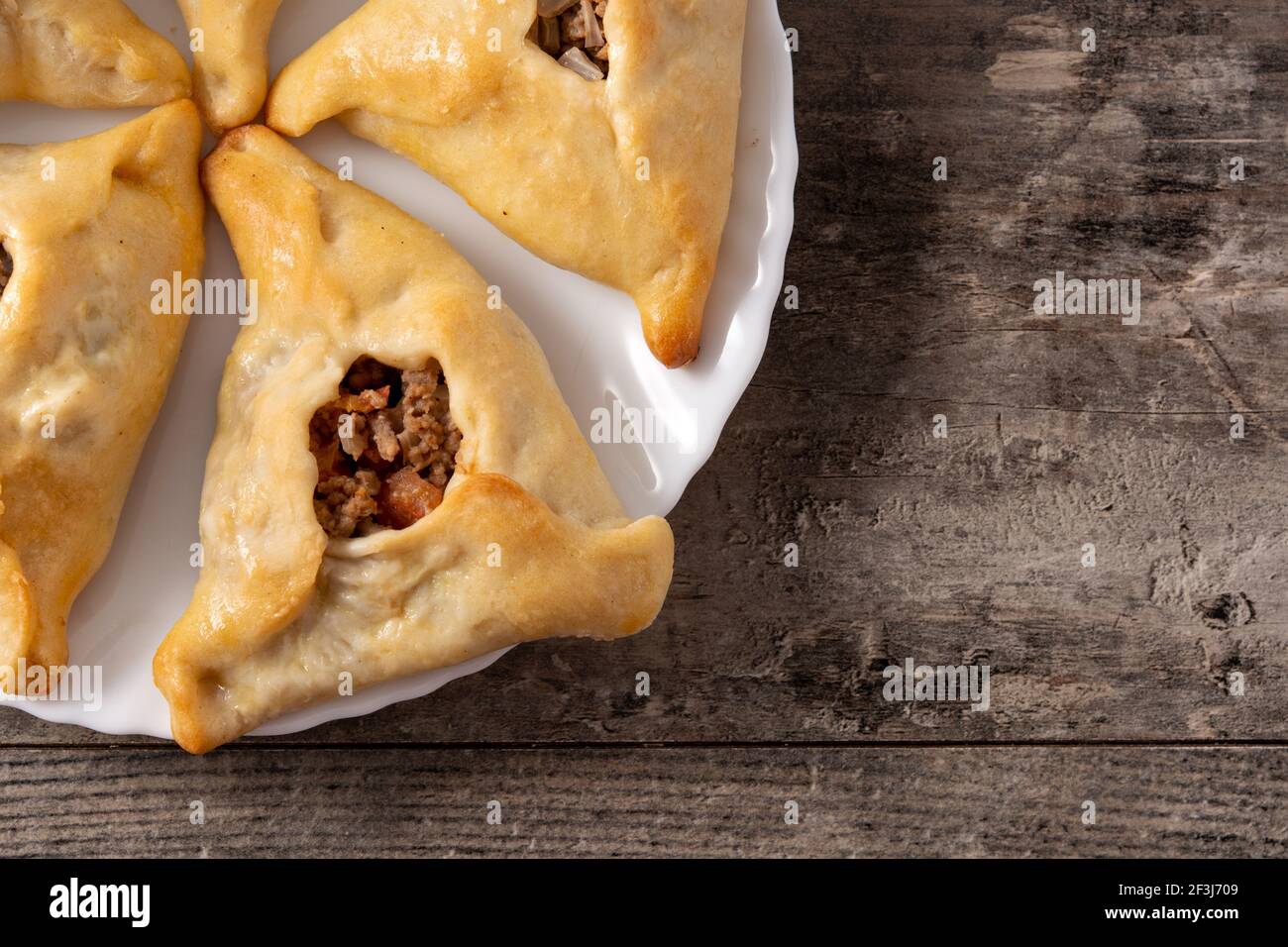Traditional middle eastern fatayer on wooden table Stock Photo - Alamy