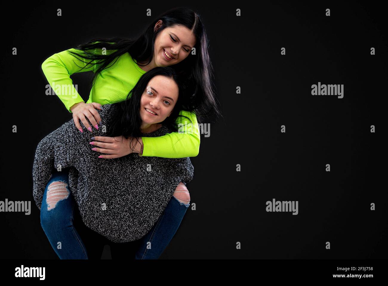 Girl carrying her sister on back hi-res stock photography and images ...