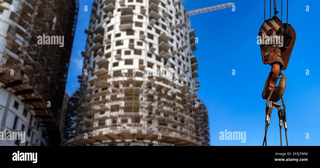Multi-storey building under construction with scaffolding (new ...