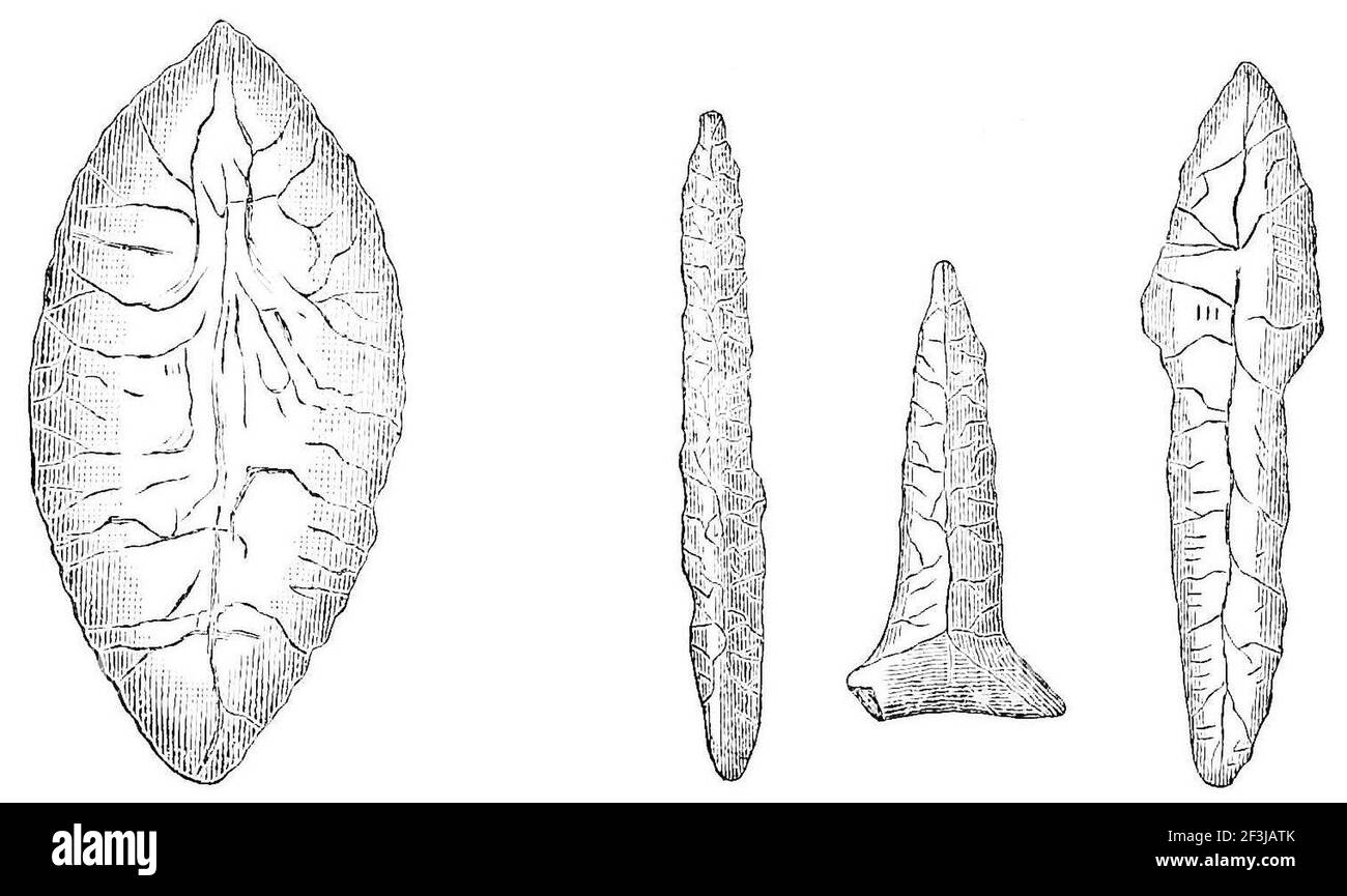 A carved flint and flint bone and shell drilling bits Stock Photo - Alamy