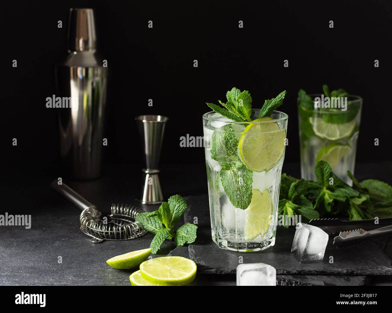 Refreshing summer mojito cocktail with ice cubes, fresh mint and lime ...