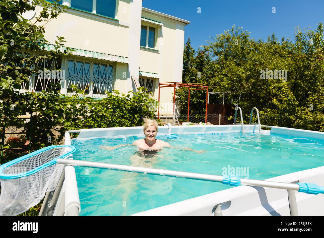 frame pool in the garden of a private house, summer Stock Photo - Alamy