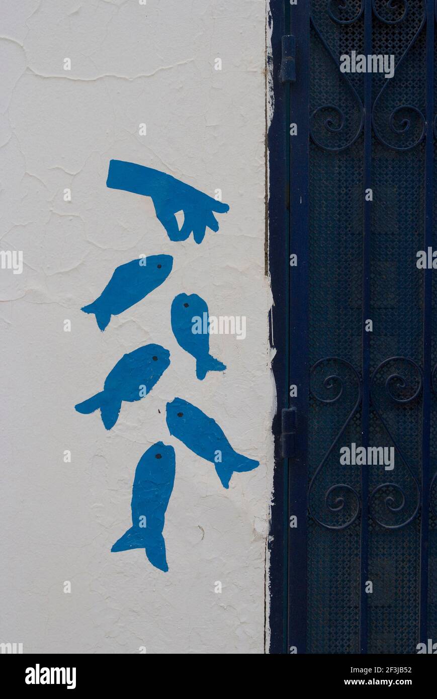 Traditional good luck symbols painted on the front of a house, the ...