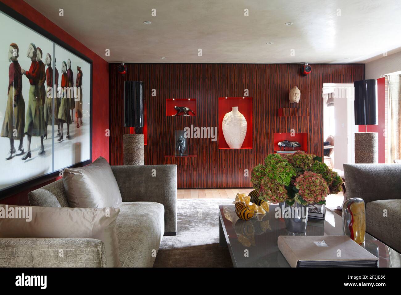 Straight view of living room looking towards wood panelled wall with ...