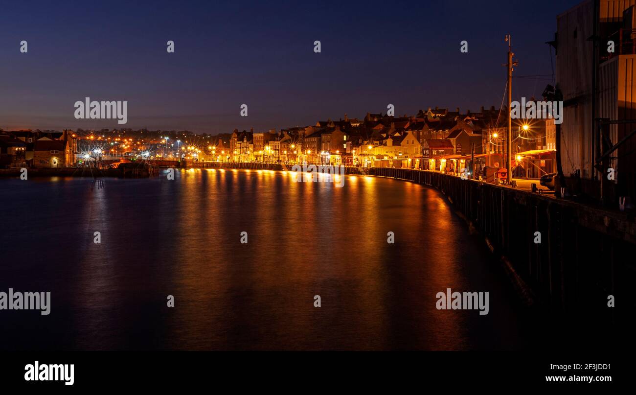 Whitby harbour and town by night hi-res stock photography and images ...