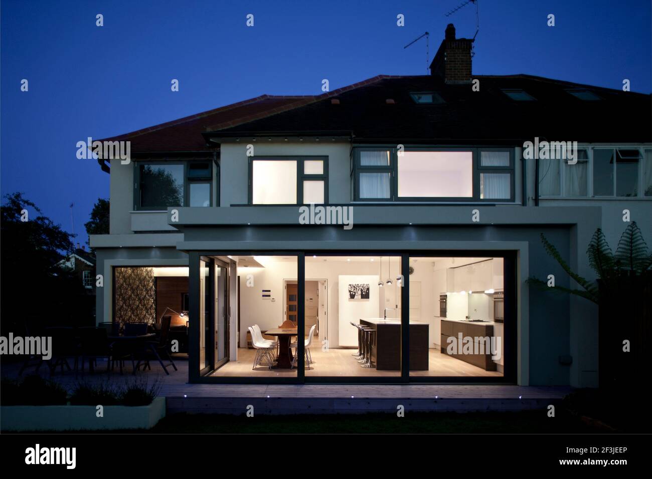 Rear exterior of closed sliding doors at night, Marble Hill conversion ...