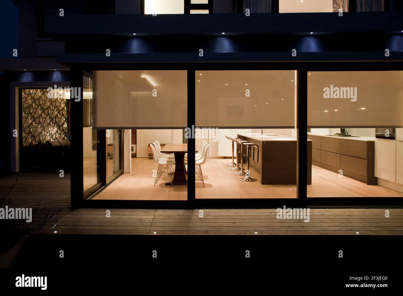 Rear exterior of closed sliding doors at night, Marble Hill conversion ...