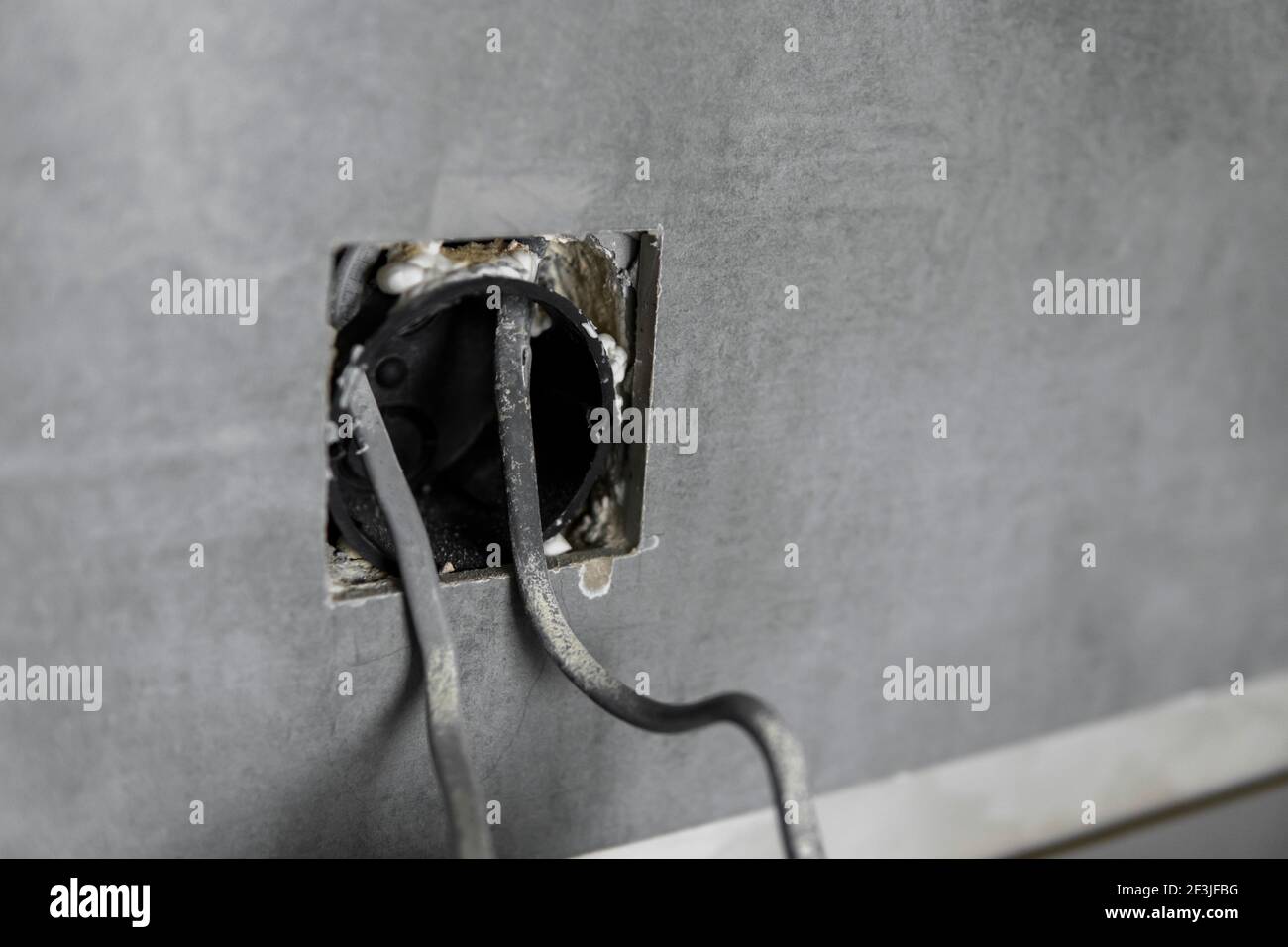 Repair or installation of a new light switch in the wall. Light switch ...