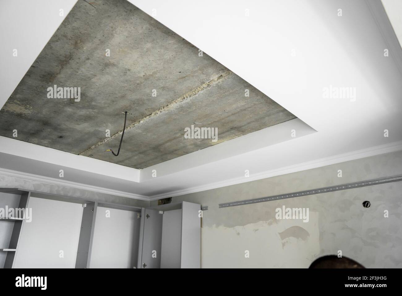 The ceiling in the kitchen is prepared for the installation of a ...