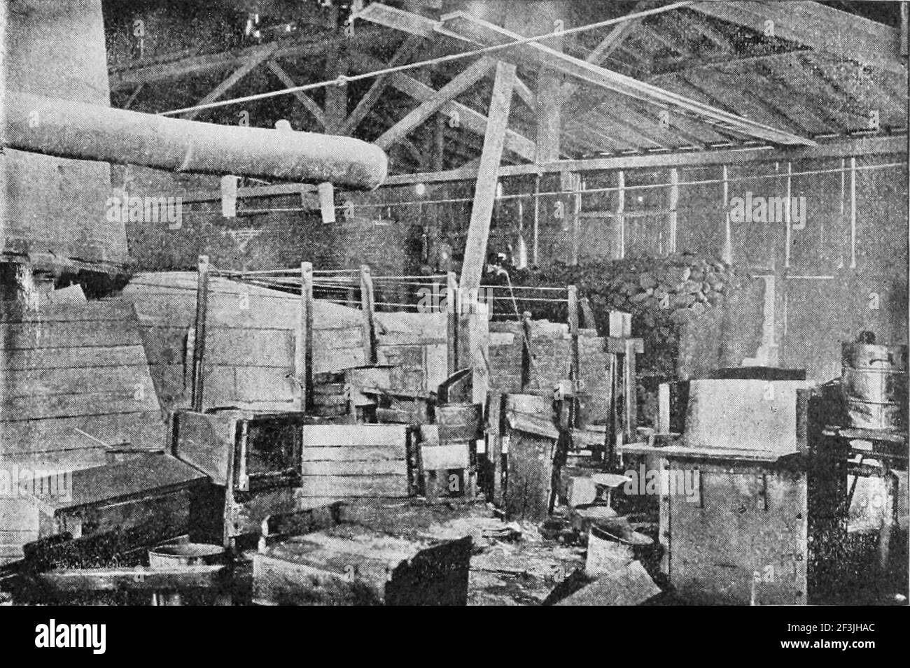 Interior view of the glass factory with gas generators and melting tank ...