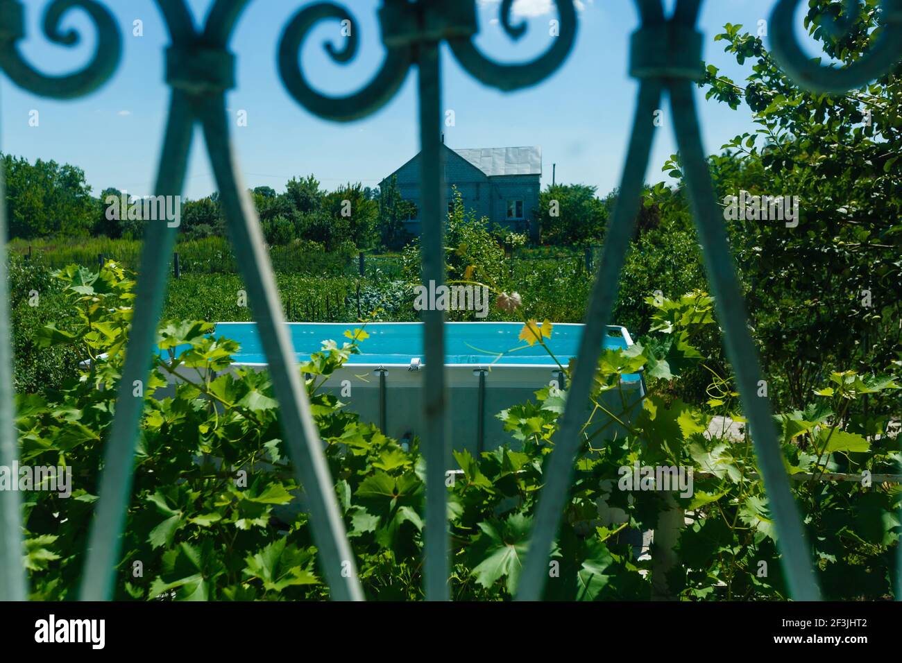 frame pool in the garden of a private house, summer Stock Photo - Alamy