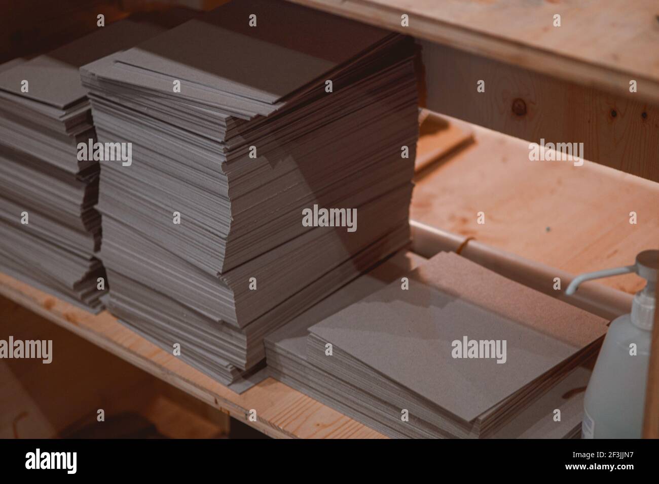 A stack of blank papers in a printing house on a wooden shelf Stock ...