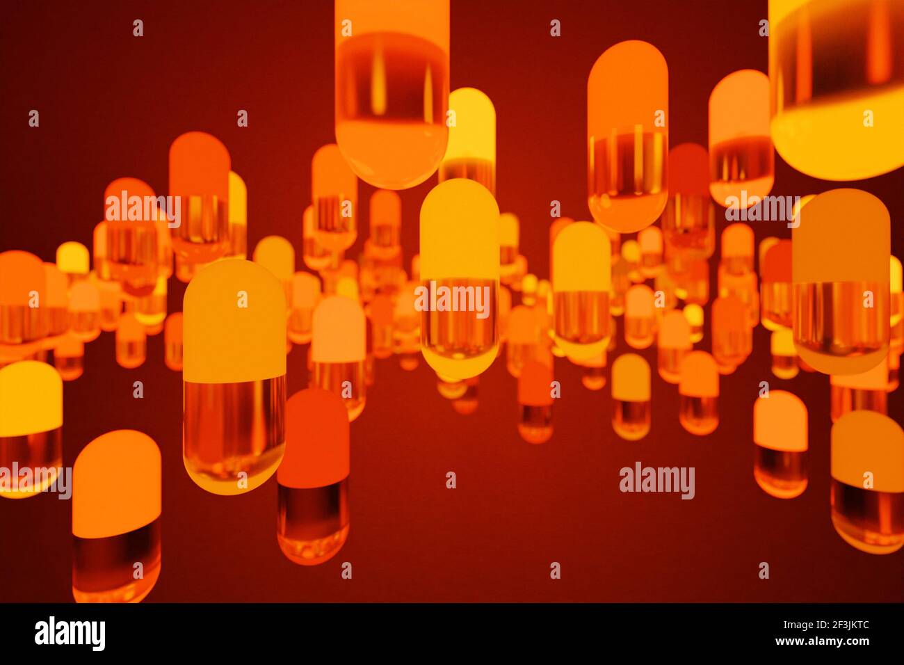 3D illustration orange capsules, tablets with medicine in even rows on ...