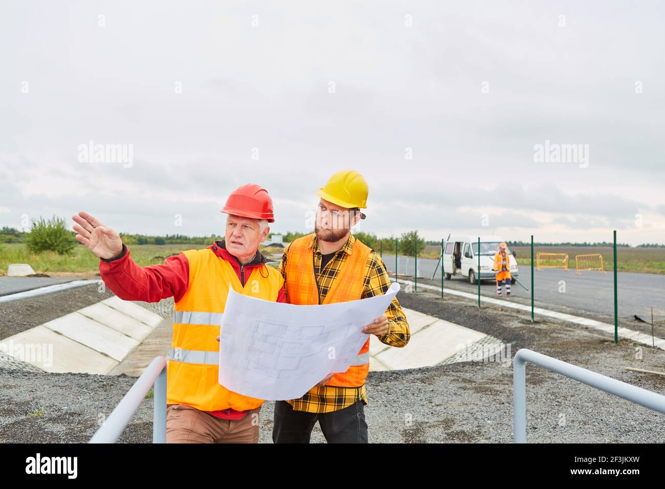 Construction worker with floor plan planning for house building and ...