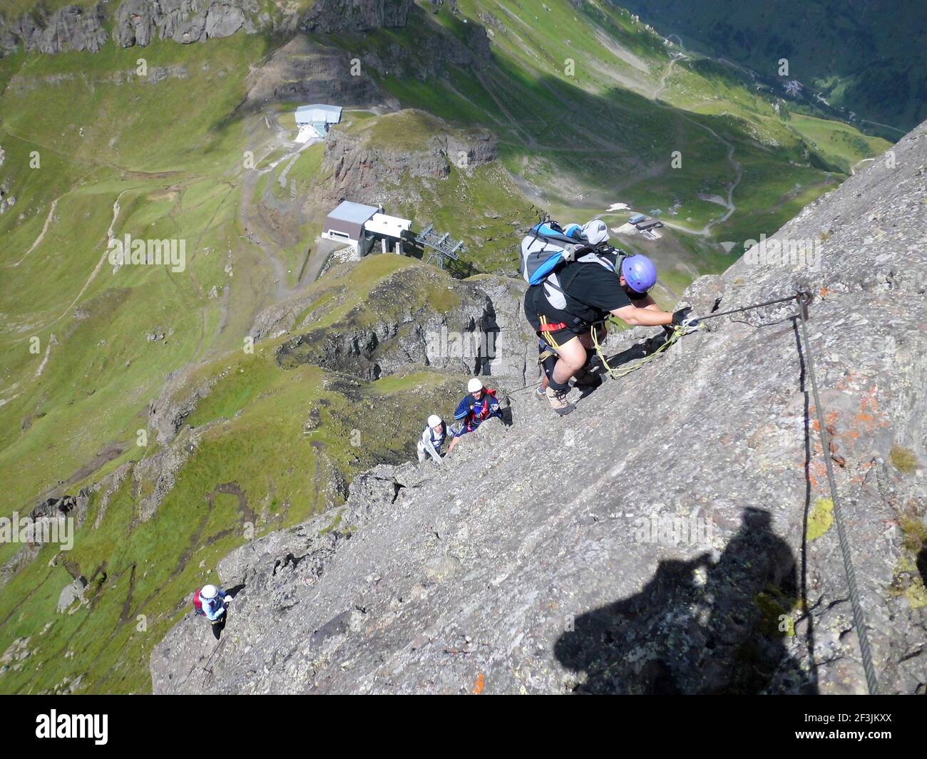 ARABBA, ITALY - Feb 16, 2021: many people climbing via ferrata delle ...