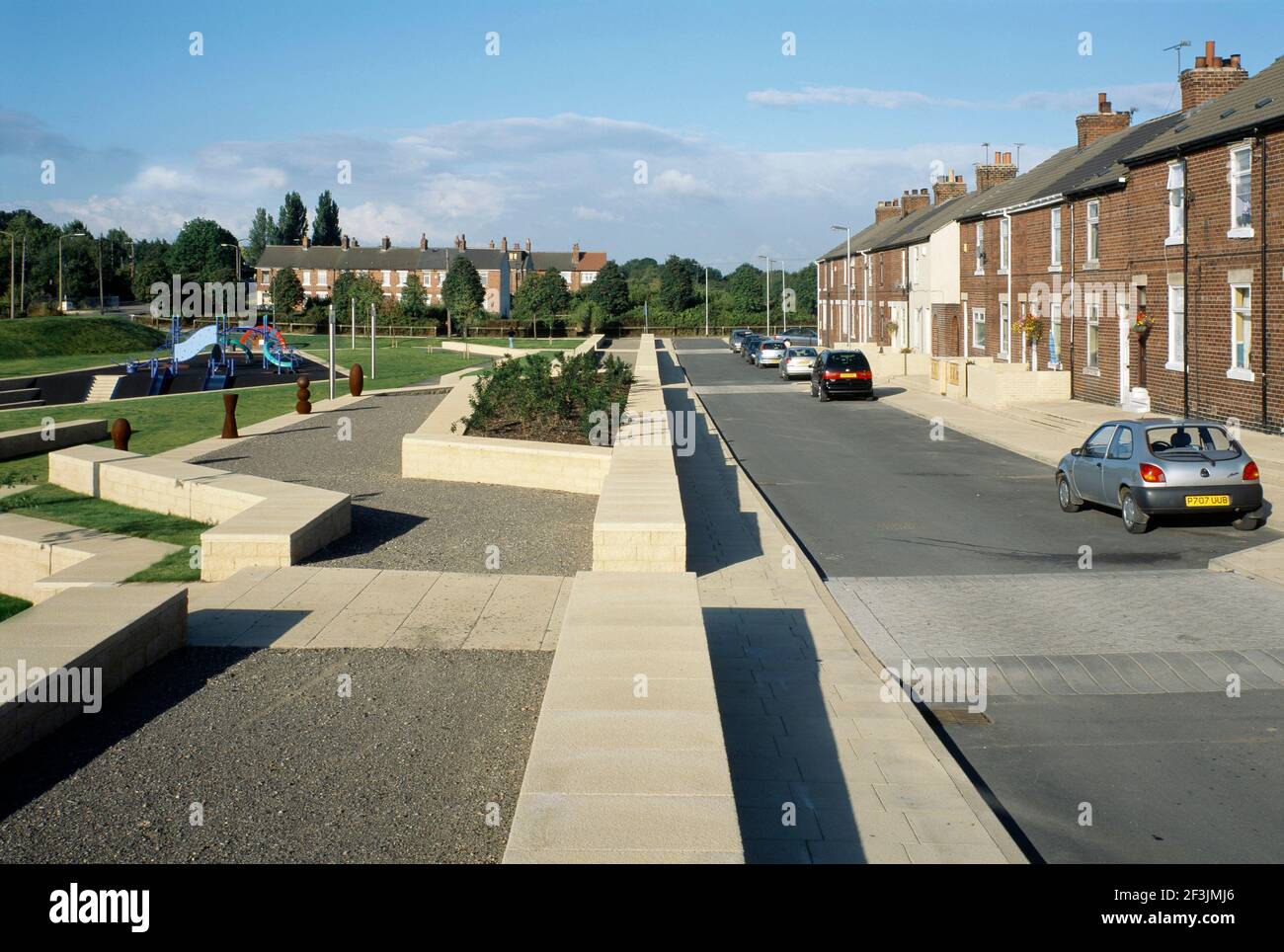 Park next to traditional style housing, Fryston, West Yorkshire Stock ...