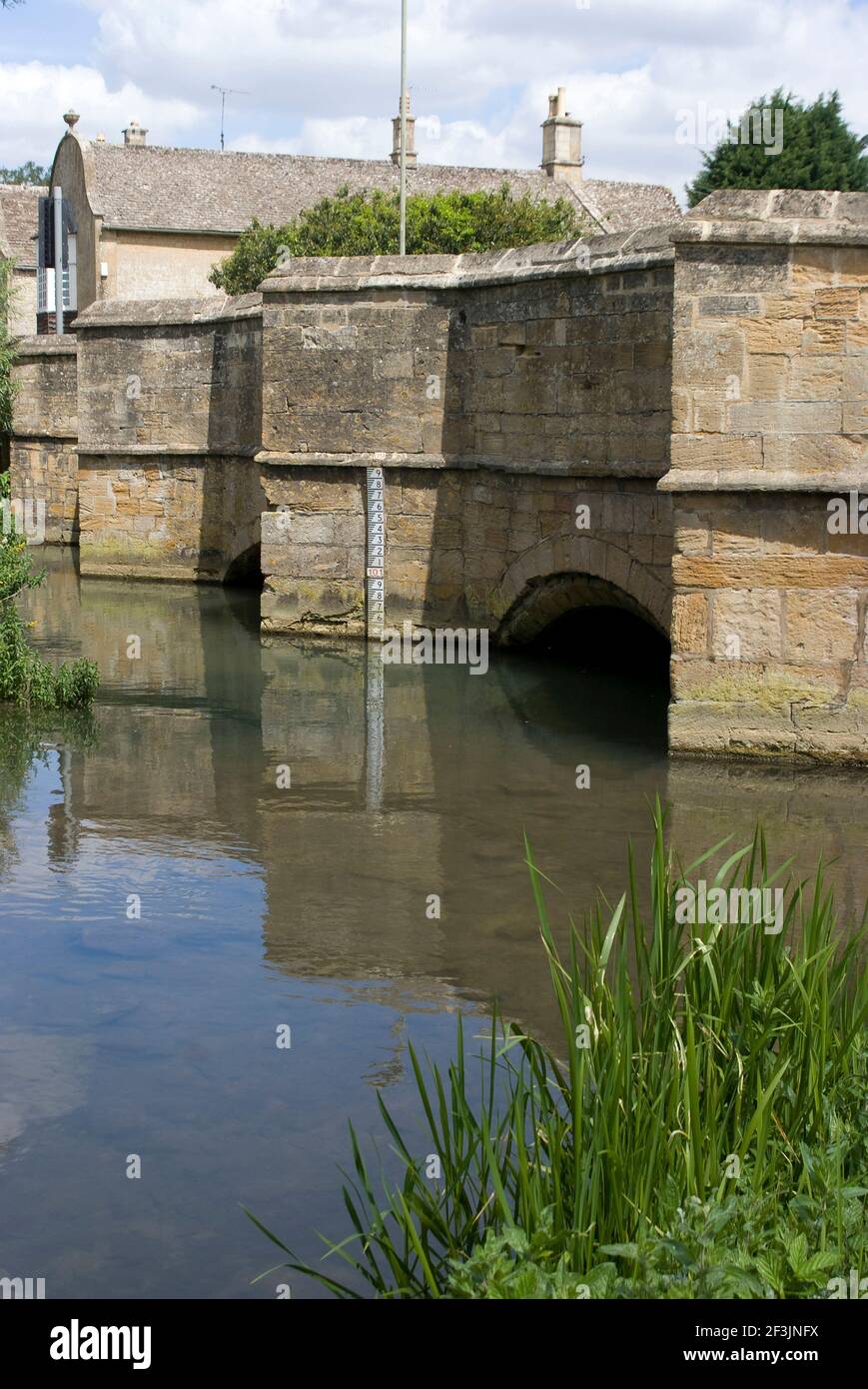 Three-arched medieval bridge over the Windrush River, Burford ...