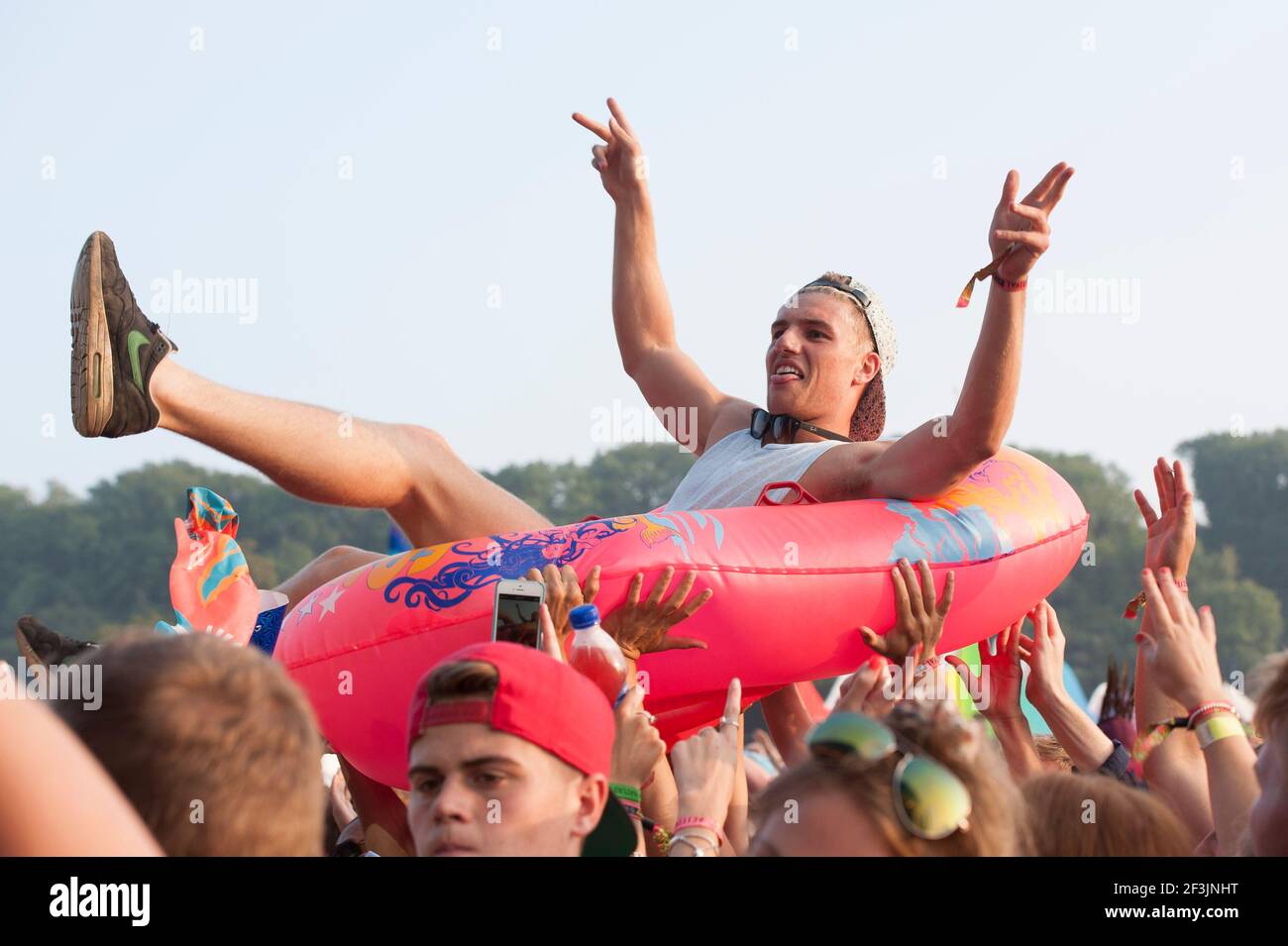 Festival goer in an inflatable boat in the main stage crowd on day 4 of ...