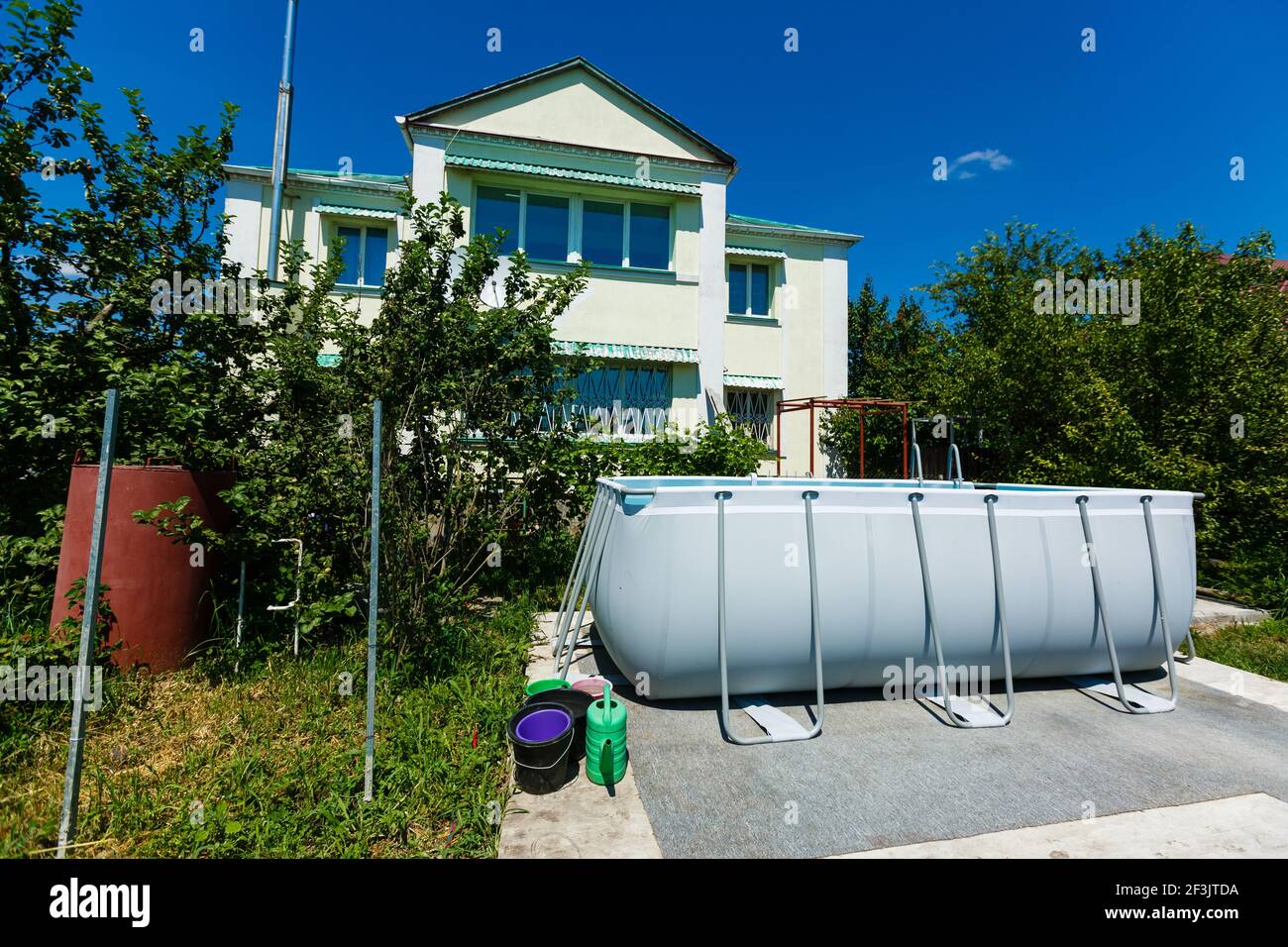 frame pool in the garden of a private house, summer Stock Photo - Alamy
