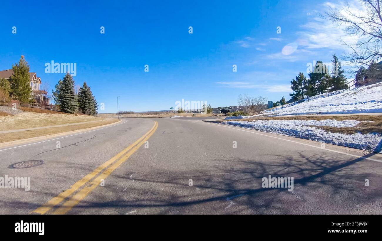 Driving on typical paved roads in a suburban upscale residential ...