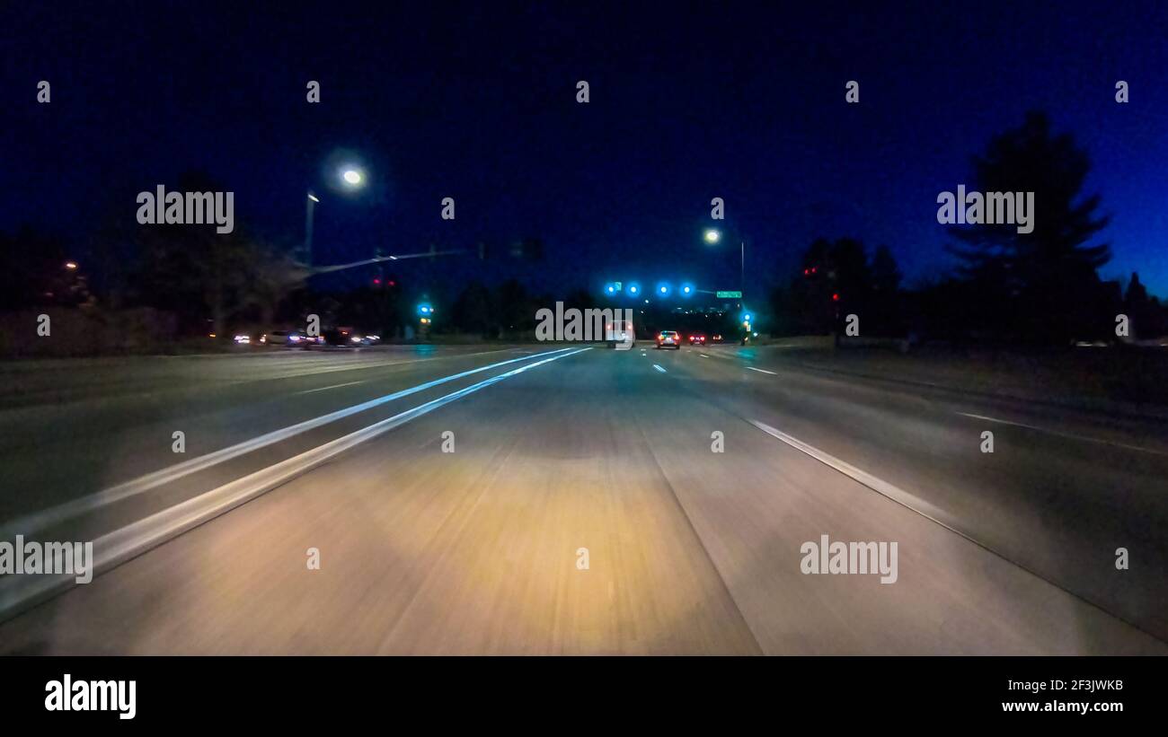 Driving on typical paved roads at night in suburban America Stock Photo ...