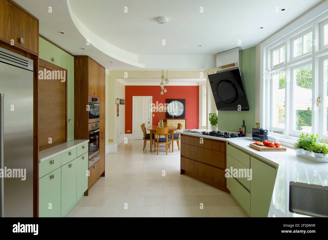 Spacious modern kitchen with view to dining room Stock Photo - Alamy