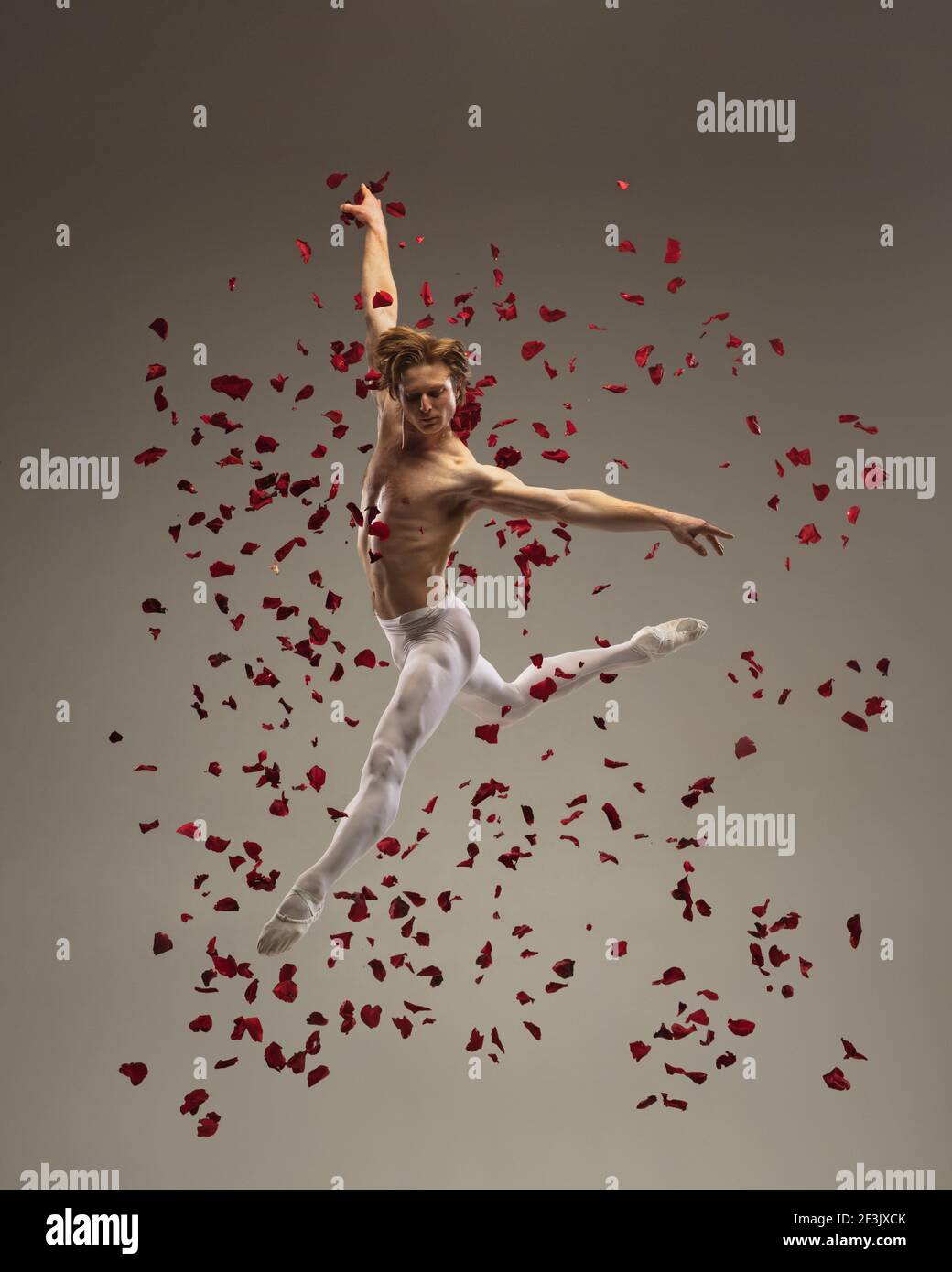 Heart. Young and graceful ballet dancer on studio background in flight ...