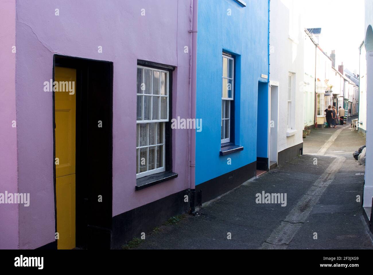 Coloured row houses on a pedestrian street in the village of Appledore ...