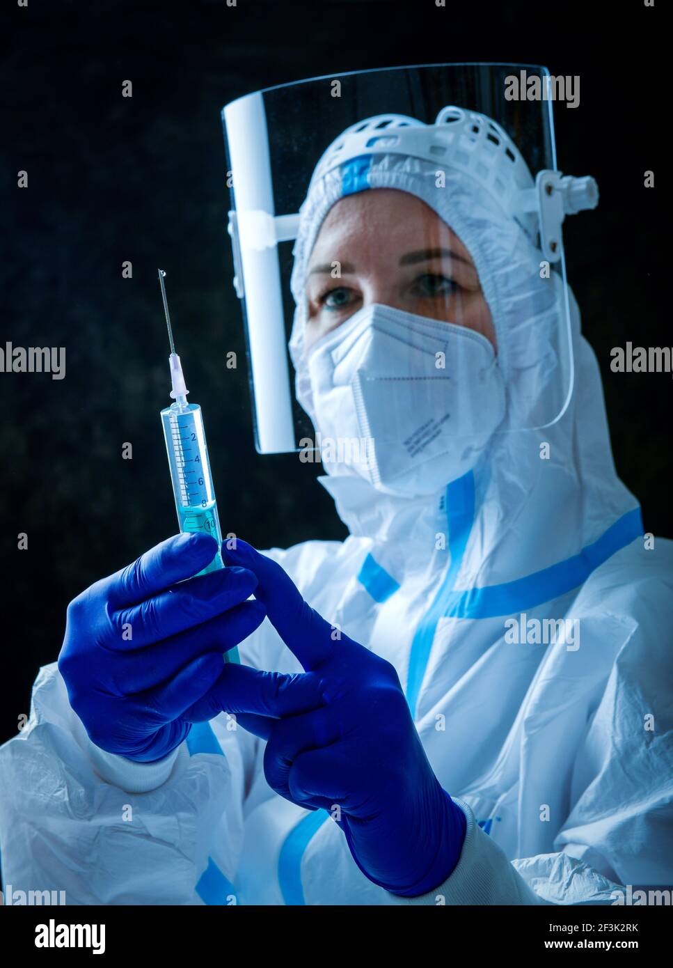 Detail closeup of syringe needle and ampoule , nurse taking injection ...