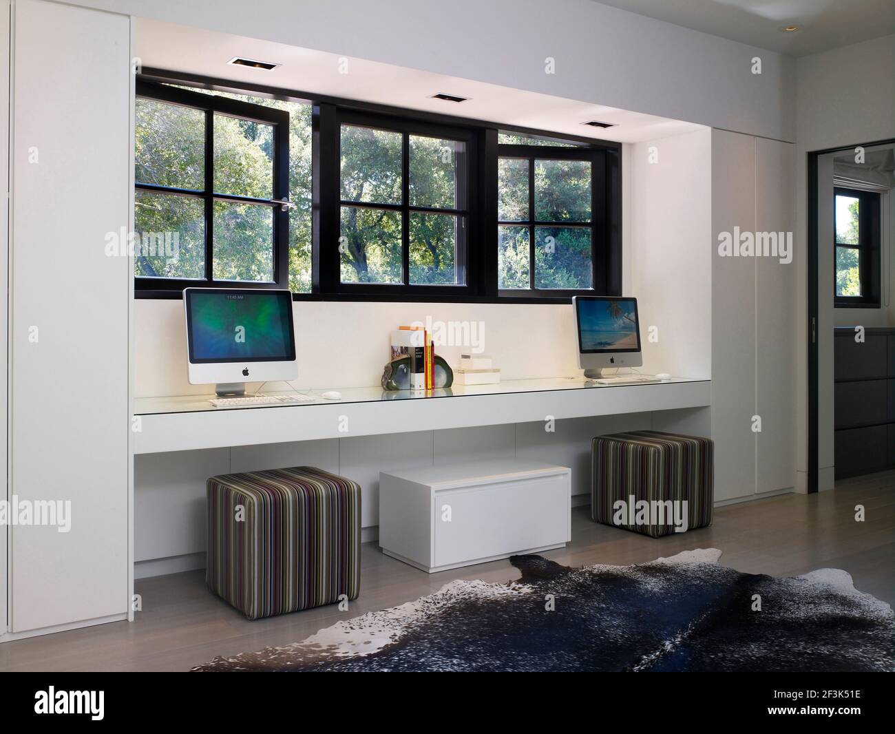 His and hers computer station below window in Stone House, Atherton ...