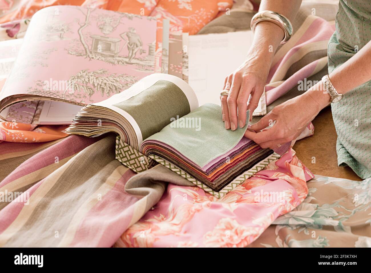 Choosing fabrics. Picture shows swatches of fabric for an interior ...