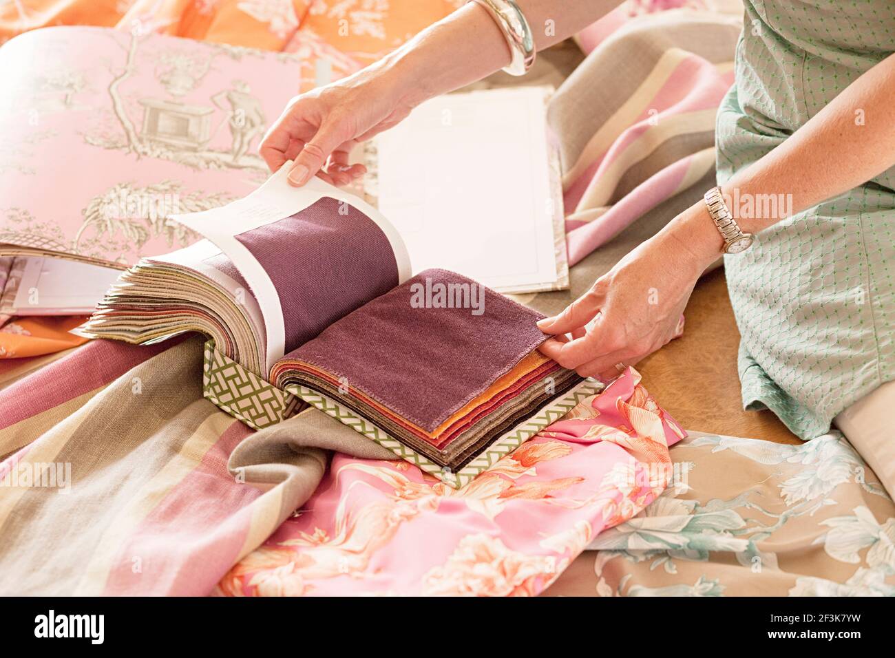 Choosing fabrics. Picture shows swatches of fabric for an interior ...