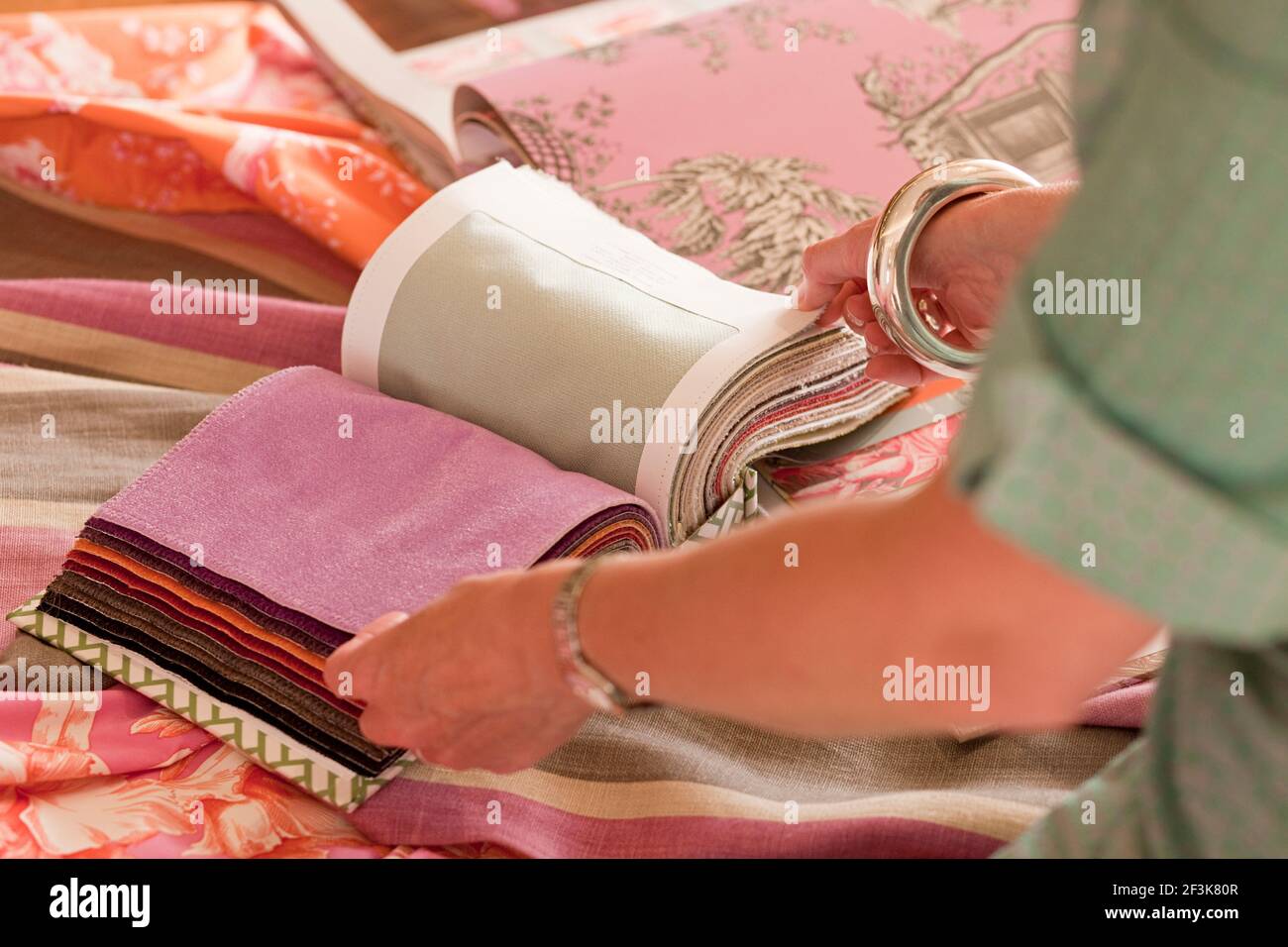 Choosing fabrics. Picture shows swatches of fabric for an interior ...