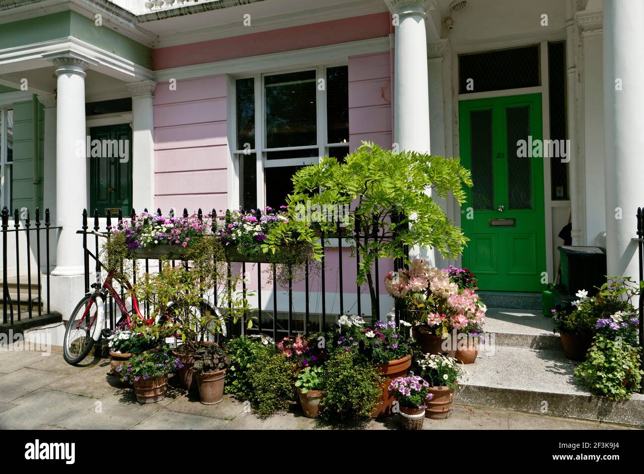 Colourful Italianate style terrace houses in Chalcot Square, Primrose ...