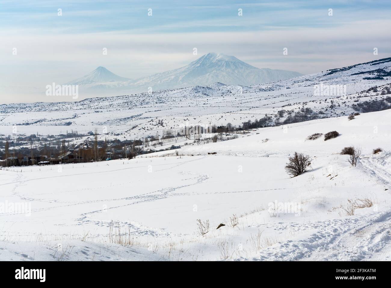 A beautiful winter landscape with the hazy snow-capped peaks of Mount ...