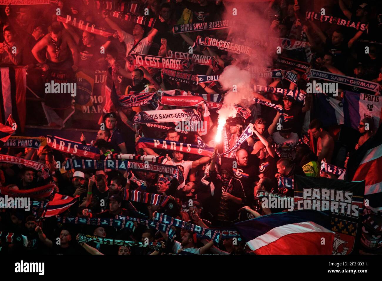 Paris saint germain fans with flares hi-res stock photography and ...