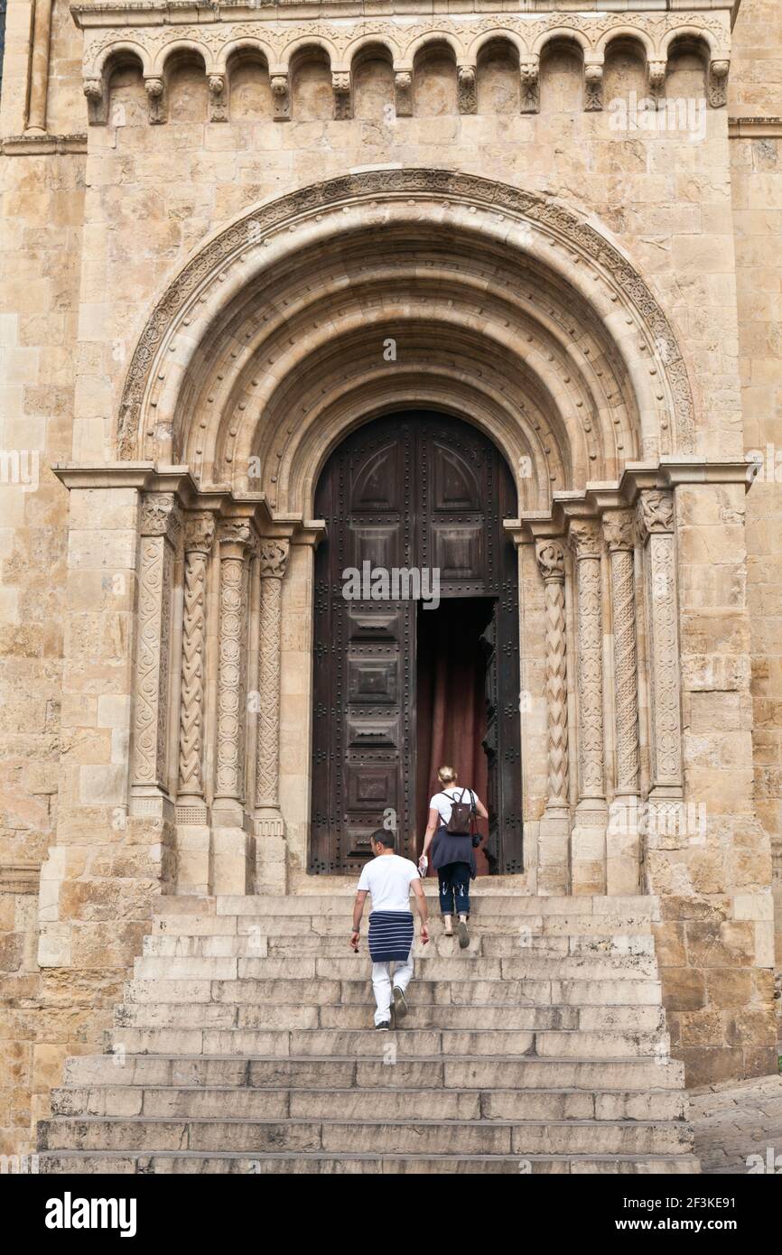 The main portal entrance to the Old Cathedral Se Velha, Coimbra, Beira ...