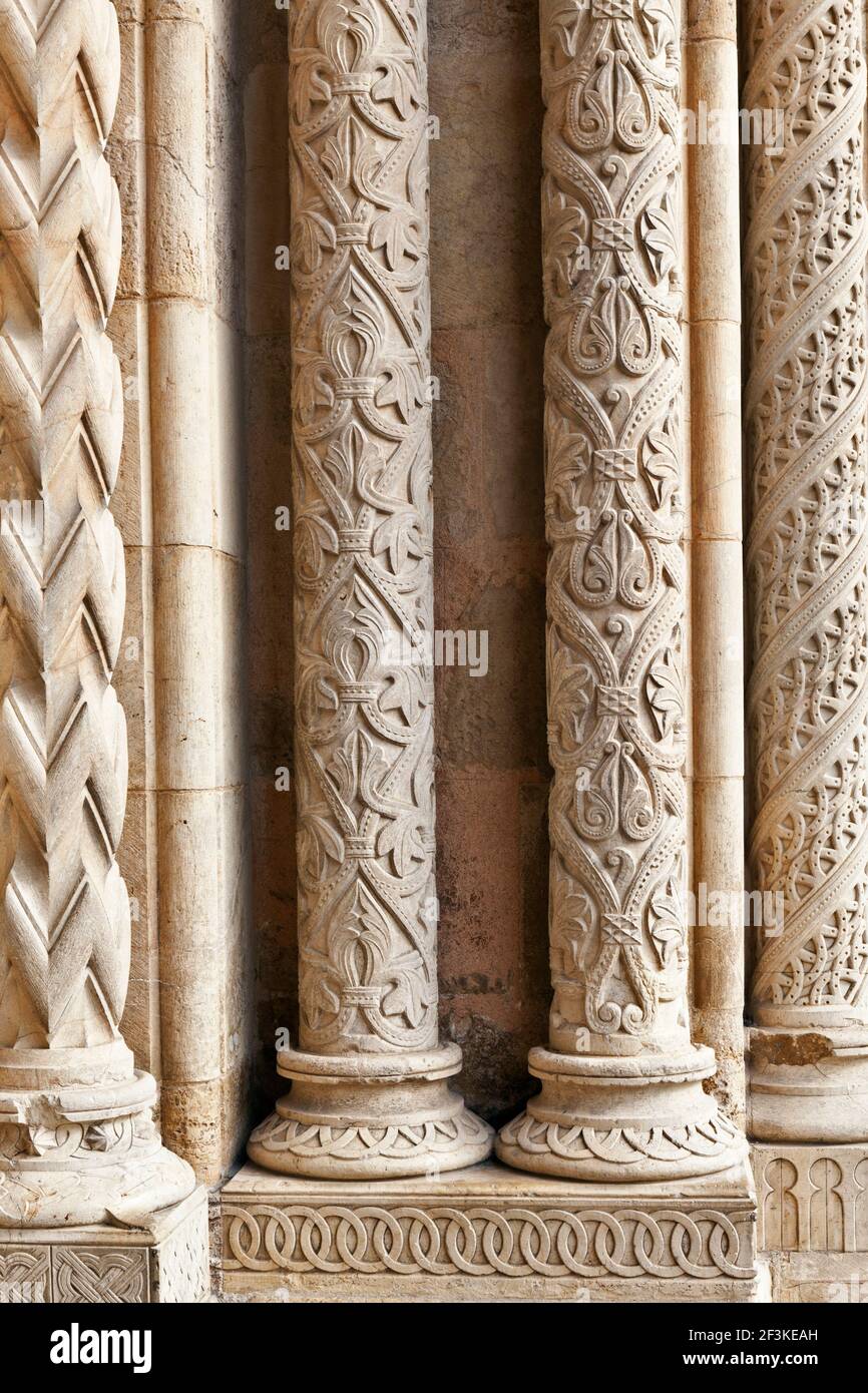The elaborately engraved Romanesque style stone pillars of the main ...