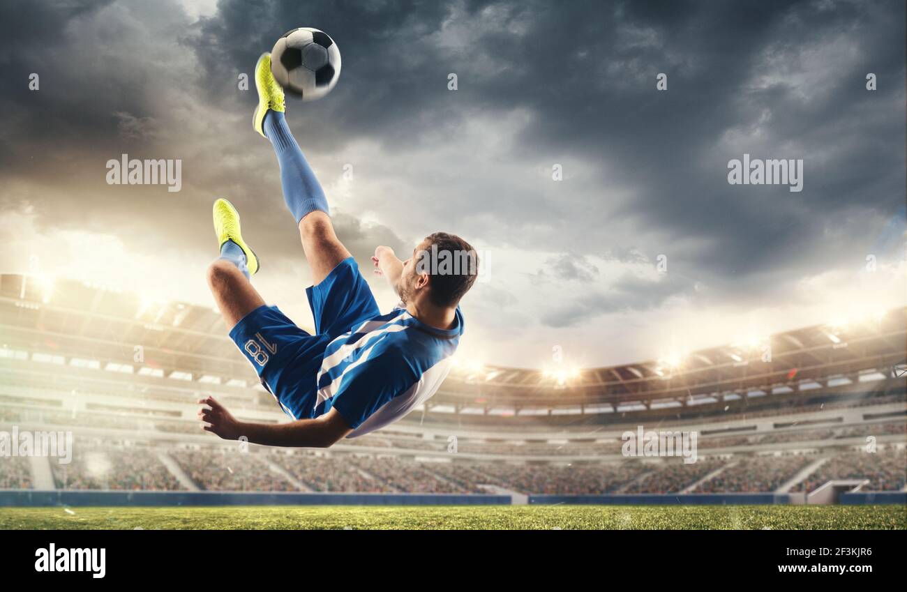 Male football or soccer player at stadium in flashlight. Young male ...