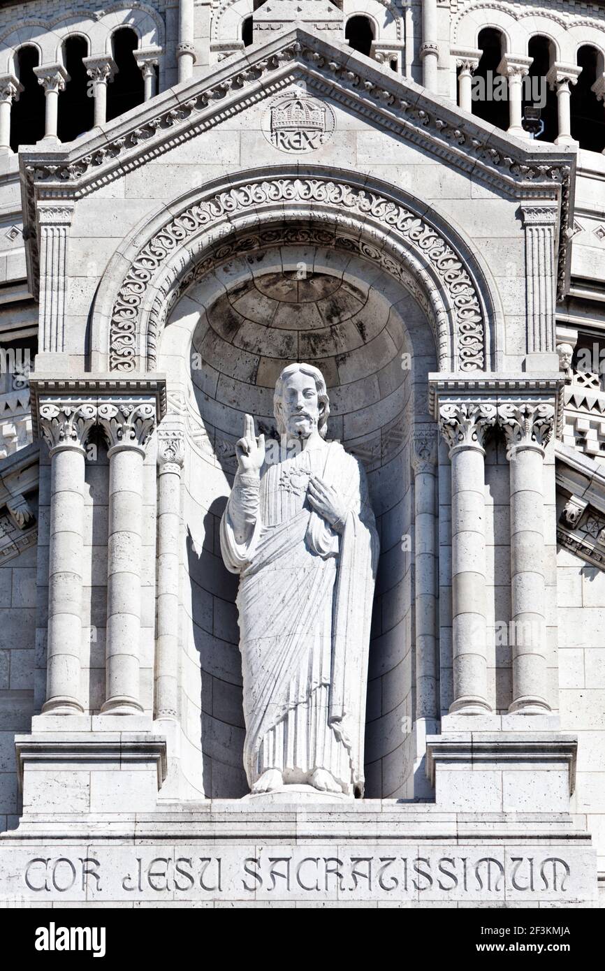 Detail of the central portico statue of Jesus adorning the Sacre-Coeur ...