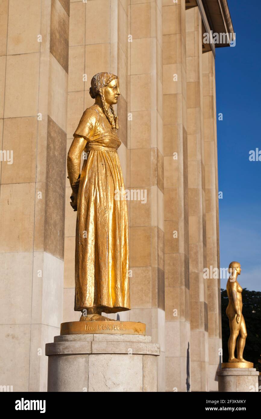 Gilded bronze statues decorate the central square of the Palais de ...