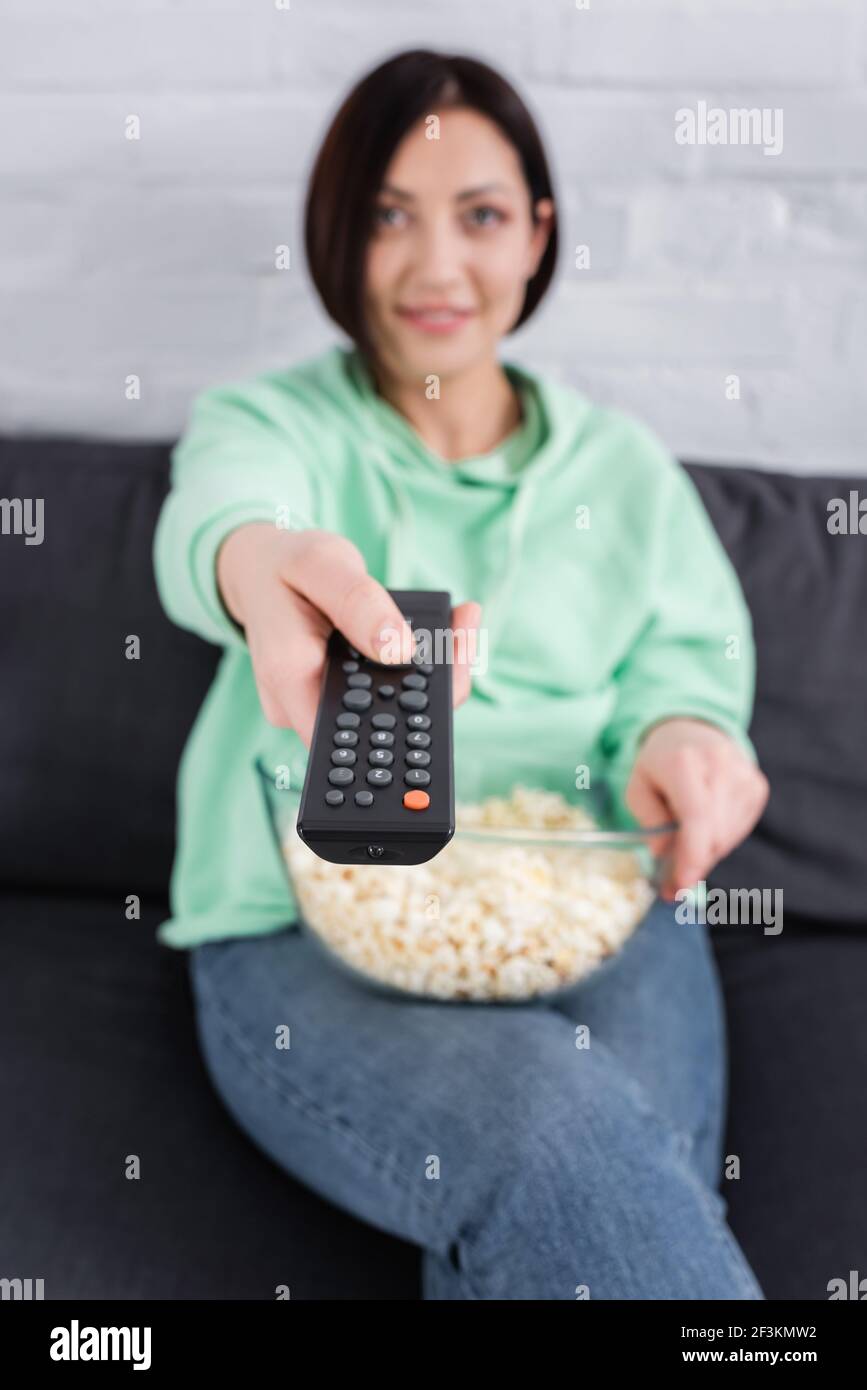 Woman remote controller in hi-res stock photography and images - Alamy