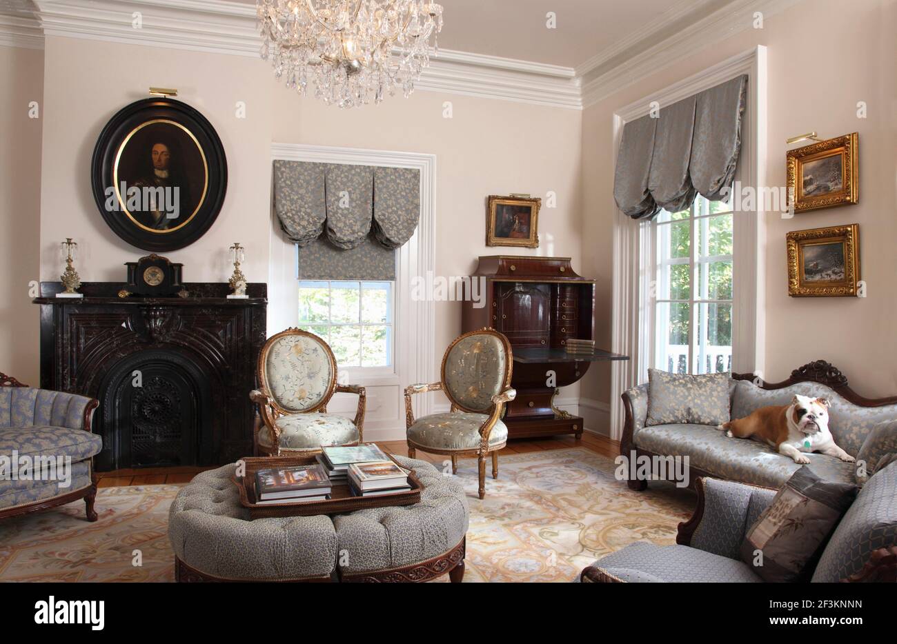 Formal sitting room with fireplace and portrait Stock Photo - Alamy