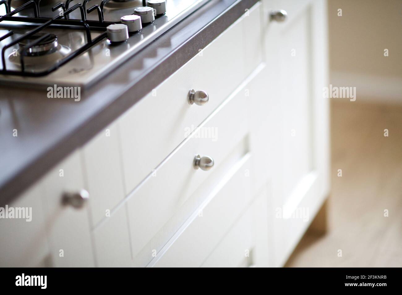 Kitchen Drawers under hob Stock Photo - Alamy