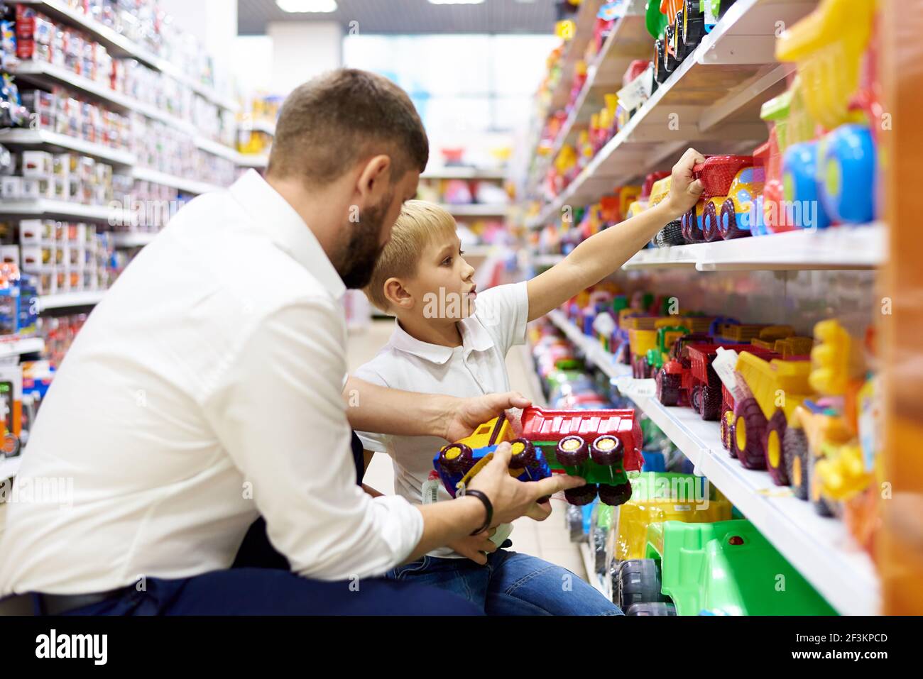 A dad with a small child is shopping at a children's store Stock Photo ...